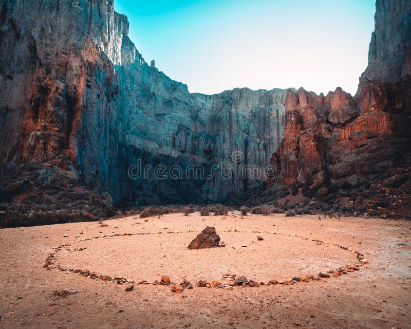 View of Stones in a Circle in the Middle of Cliffs Under the Blue Sky ...