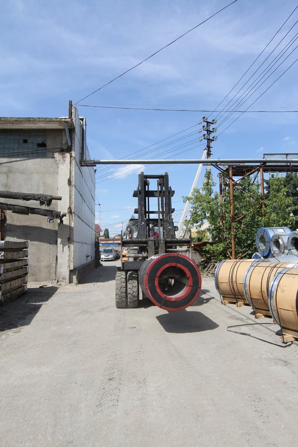 View of the Storage of Steel Coils with Loader Stock Photo - Image of ...