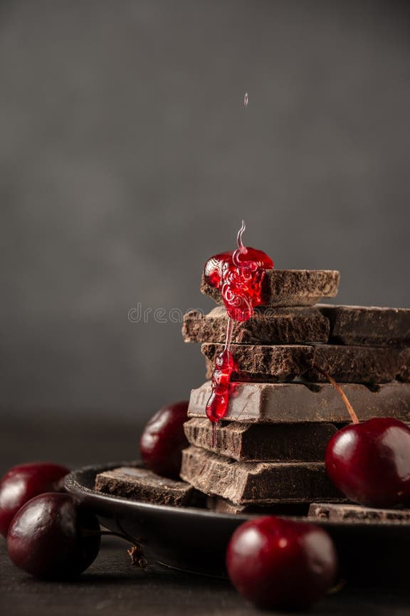 View of Strawberry Syrup on Stack with Chocolate Tablets Stock Image ...