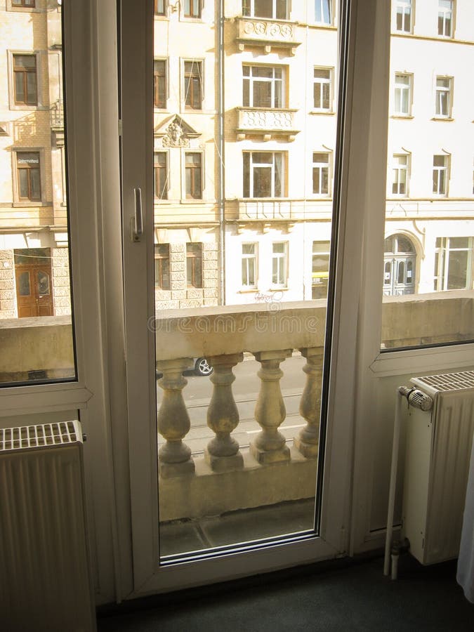 A View of the Street from the Balcony in the Daytime through a Locked ...