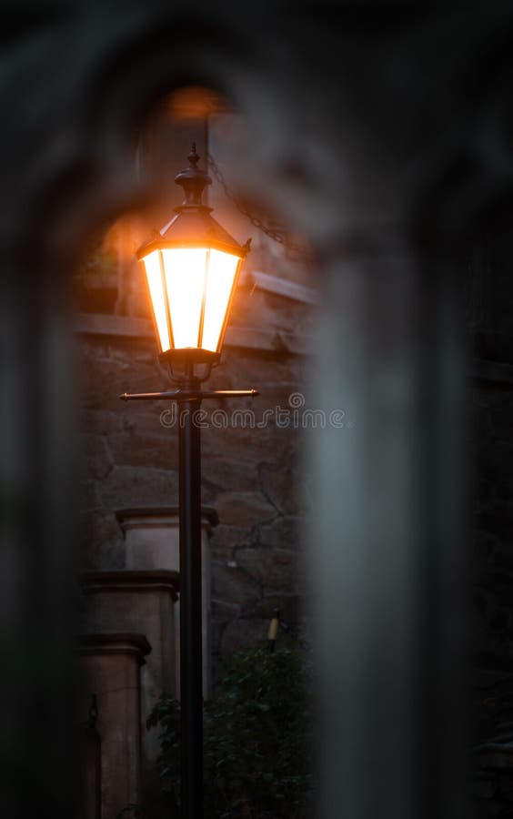 View of a Street Lamp from a Hole Stock Image - Image of urban, bright ...