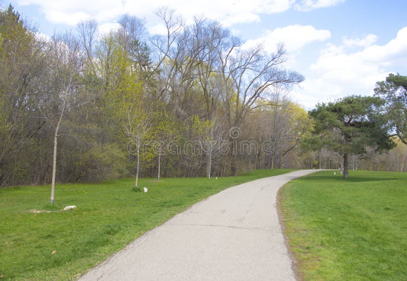 View of a suburban park stock image. Image of pathway - 217233139