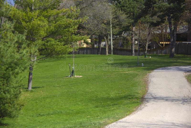 View of a suburban park stock photo. Image of fence - 217233154