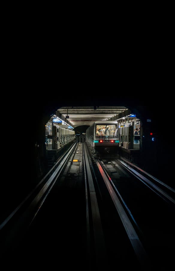 View from the Subway Tracks Inside the Tunnel of a Subway Train Packed ...