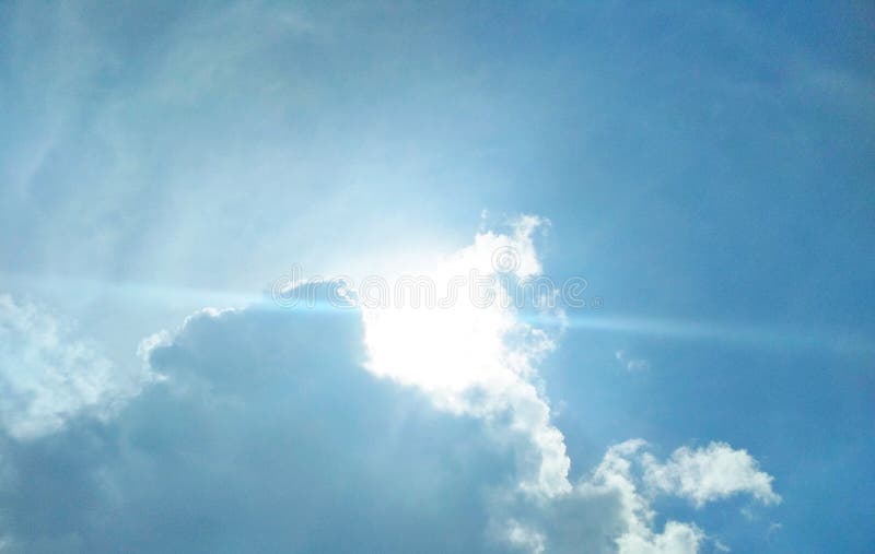 The Sun Brightly Shining in the Cloudy Sky Stock Photo - Image of ...