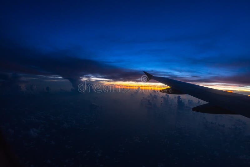 View the Sunrise and Clouds from the Flight Window Stock Photo - Image ...