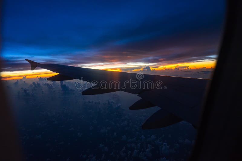 View the Sunrise and Clouds from the Flight Window Stock Photo - Image ...