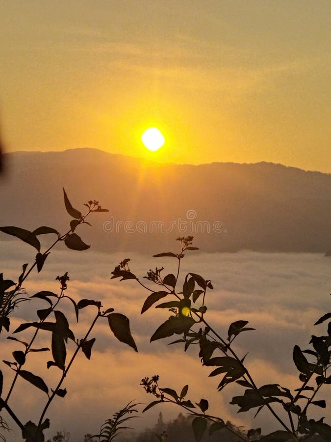 A View of the Sunrise Over a Mountain Peak Stock Photo - Image of ...