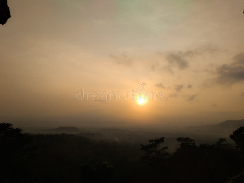 The View of the Sunrise from the Top of a Hill Looks Amazing Stock ...