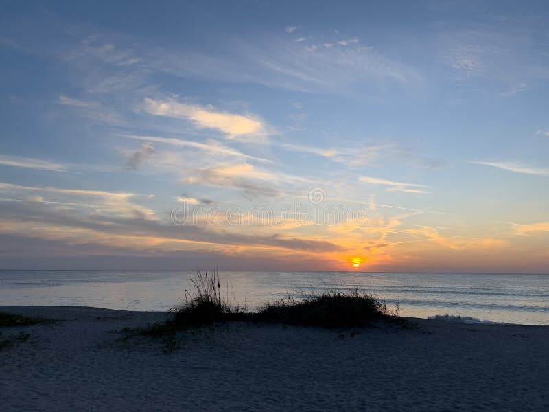 A View of a Sunset on the Beach at Siesta Key, Florida with a Blue ...