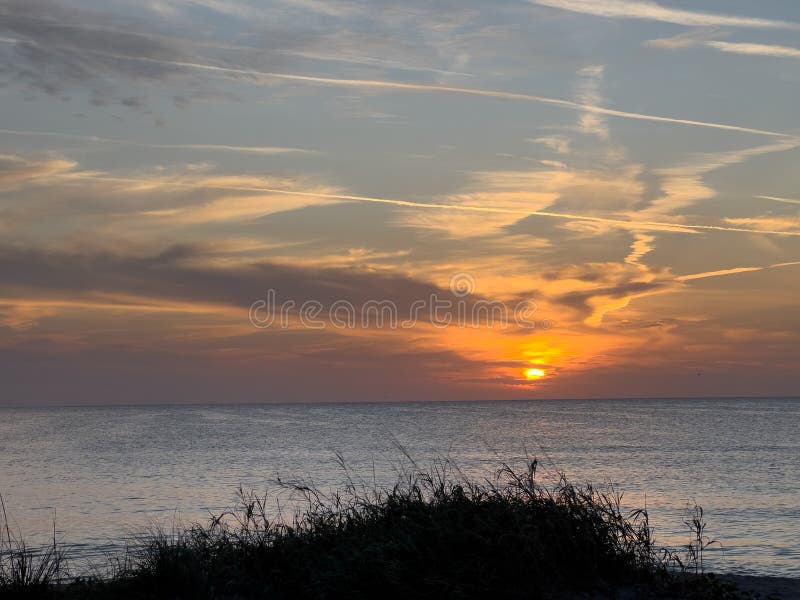 A View of a Sunset on the Beach at Siesta Key, Florida with a Blue ...