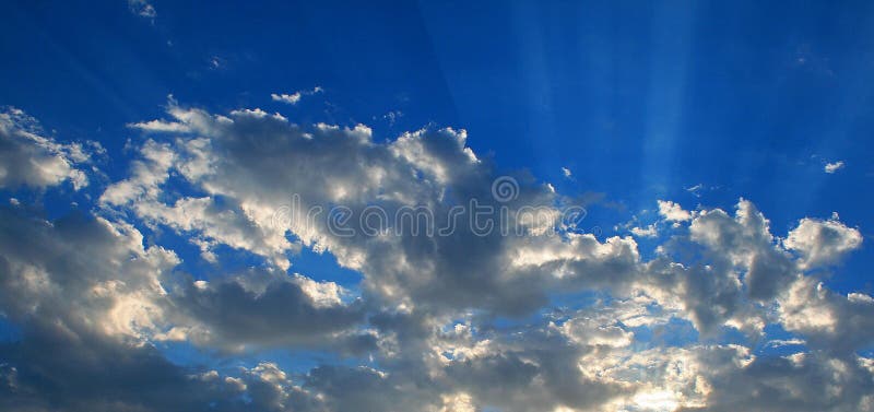 RADIATING CLOUDS and LIGHT SHAFTS Stock Photo - Image of sunset ...