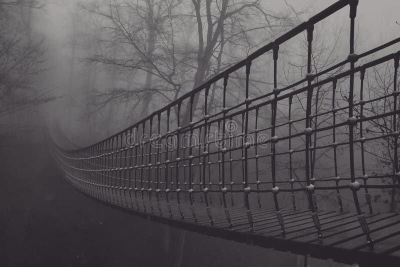 View of a Suspension Bridge in the Fog Stock Photo - Image of ...