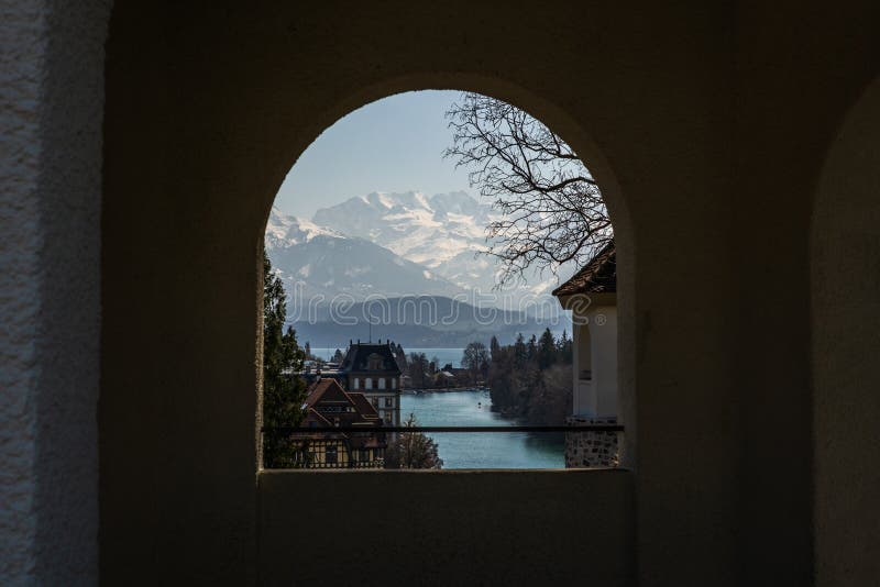 View of the Swiss Alps through a Window in Spring in the Swiss Town of ...