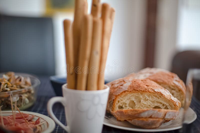 View of Table Prepared for Brunch, with Sliced Rustic Bread, Cup with ...