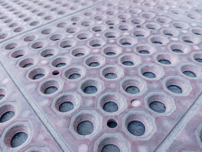 View of a Textured Industrial Floor Mat with a Repeating Pattern of ...