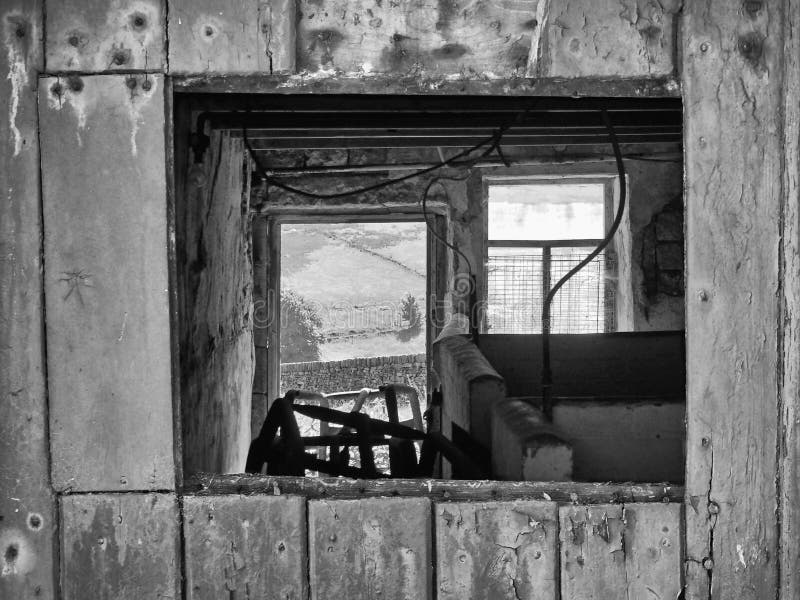 View Though a Broken Window into an Old Agricultural Building with ...
