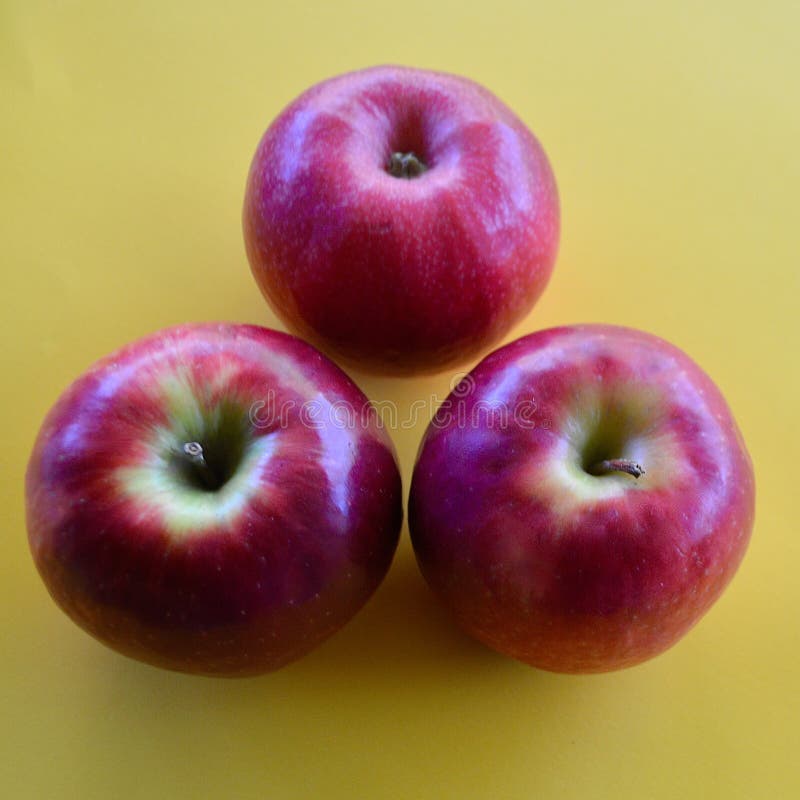 A View of Three Pink Lady Apples on Thge Table. Stock Image - Image of ...