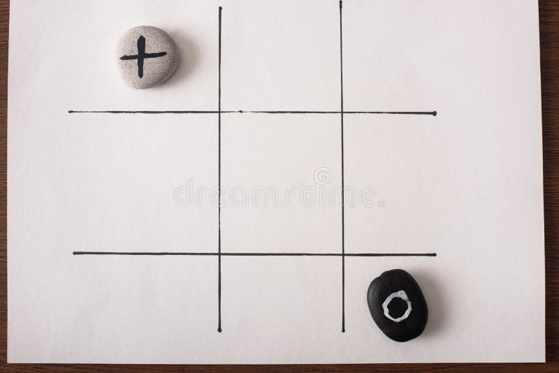 View of Tic Tac Toe Game with Stones Marked with Naught and Cross on ...