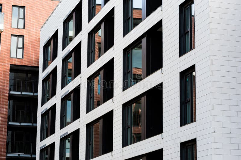 View on New Construction Brick Apartment Complex Square Windows. Modern ...