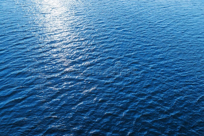 View To Blue Water with Sun Reflections Stock Photo - Image of ...