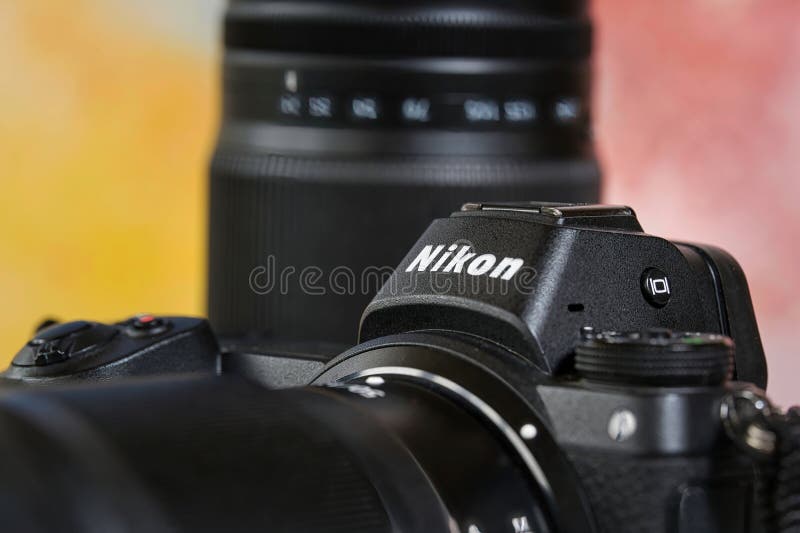 View To the Front of a Camera with an Unfocussed Lens in the Background ...