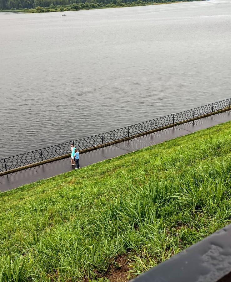 View from the Top of the Grassed Slope Down To the Beautiful River ...
