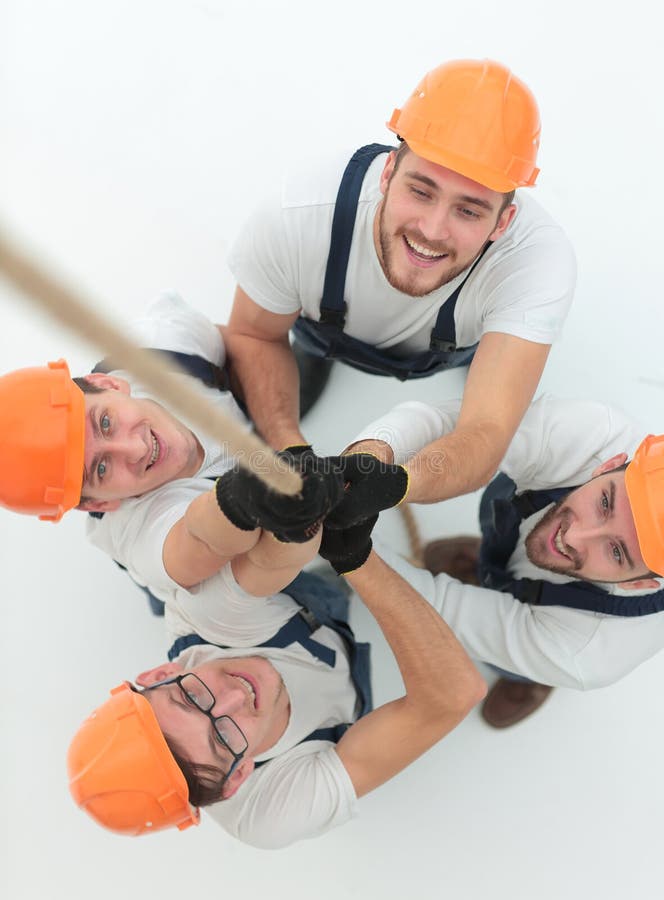 View from the Top.a Group of Workers Pulling a Rope Stock Photo - Image ...