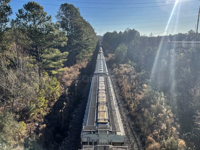 View of the Top of a Long Metal Mesh Top Train As it Passes Stock Image ...