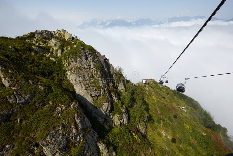 View from Top of Ropeway with Multiple Seats and Stretched Cables Above ...