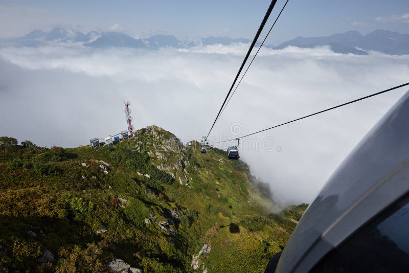 View from Top of Ropeway with Multiple Seats and Stretched Cables Above ...