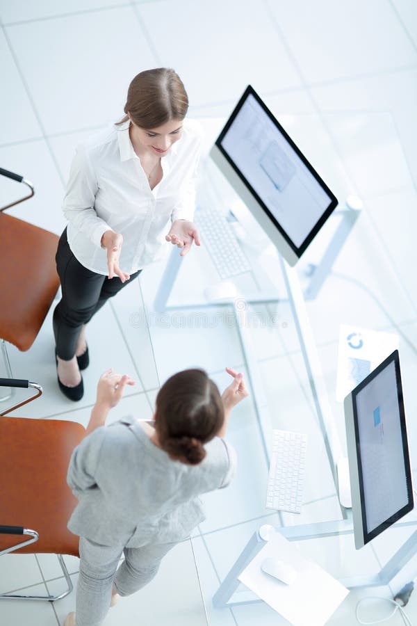 View from the Top.two Women Colleagues Discuss a Work Problem. Stock ...
