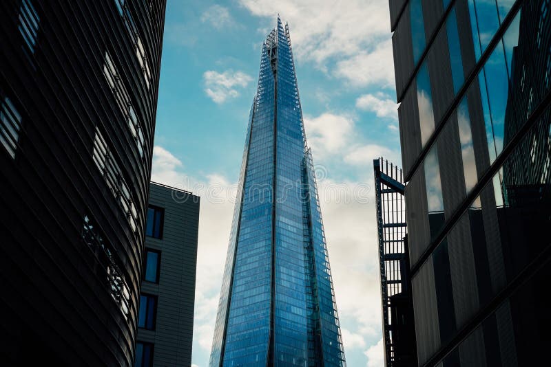 The View of a Skyscraper from Below through Some Buildings with Blue ...
