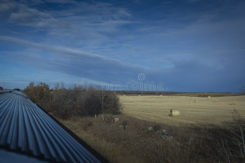 View from Train at Field with Hay Bales Stock Photo - Image of asphalt ...