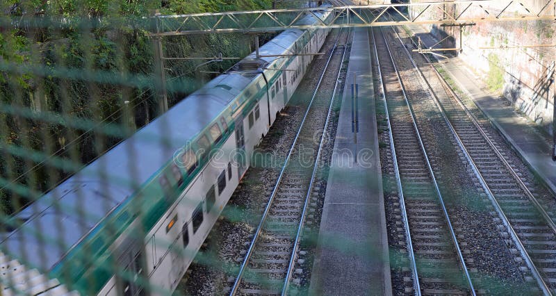 View of the Train Running on the Tracks and the Safety Net Stock Photo ...