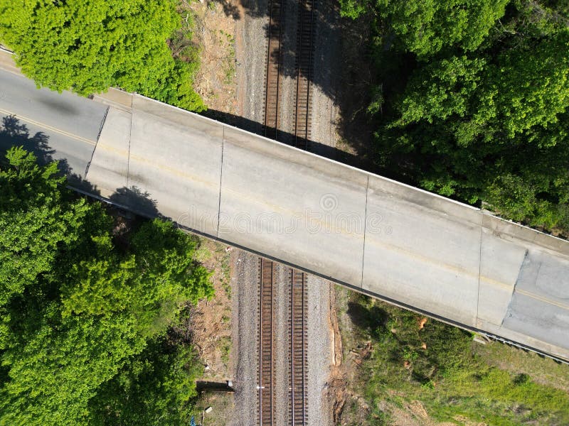 View of a Train Track with a Bridge Over Snaking through a Verdant ...