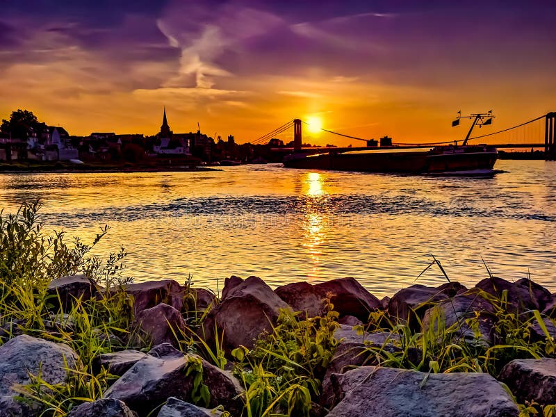 View on a Transportation Ship while Orange Sundown at the Riverside of ...