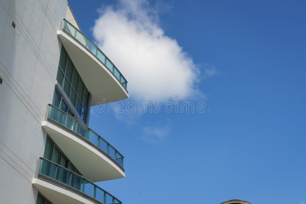 View of Triangular Balconies with Glass Railings from Below at Miami ...