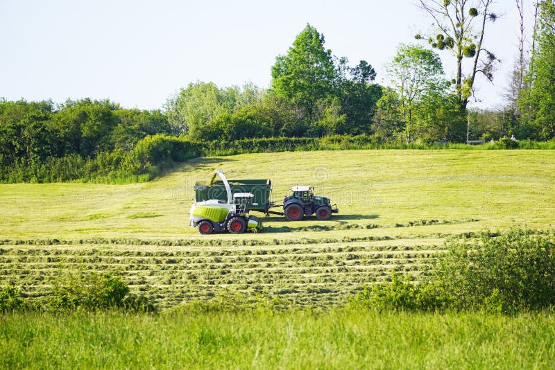 View of the Two Agricultural Vehicles Harvesting the Hay Stock Image ...