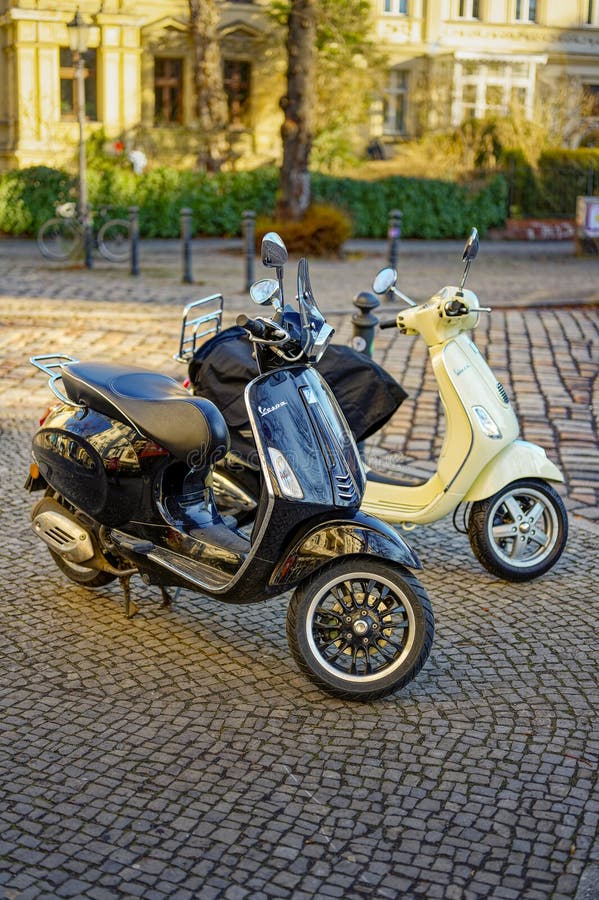 View of Two Motor Scooters Parked on a Sidewalk in Berlin Editorial ...
