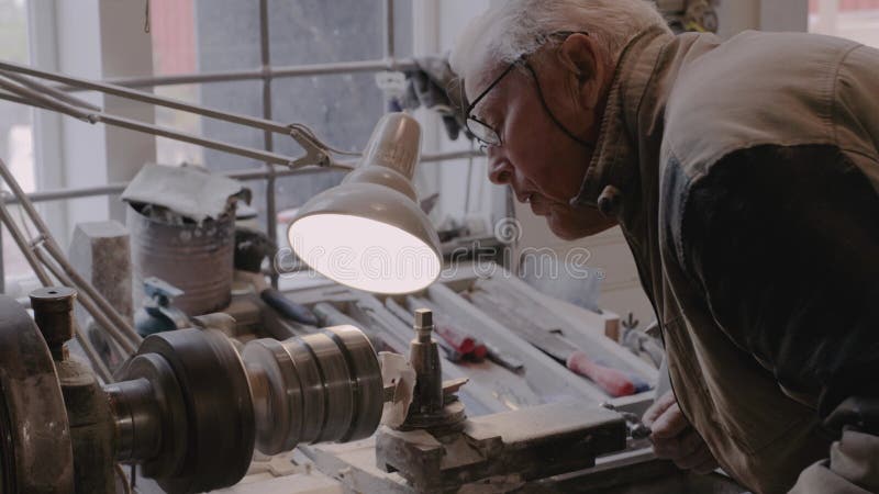 View of Two Old Men Working on Industrial Machine during Excursion ...