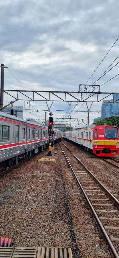 View of Two Trains Passing Back and Forth at the Station with a Traffic ...