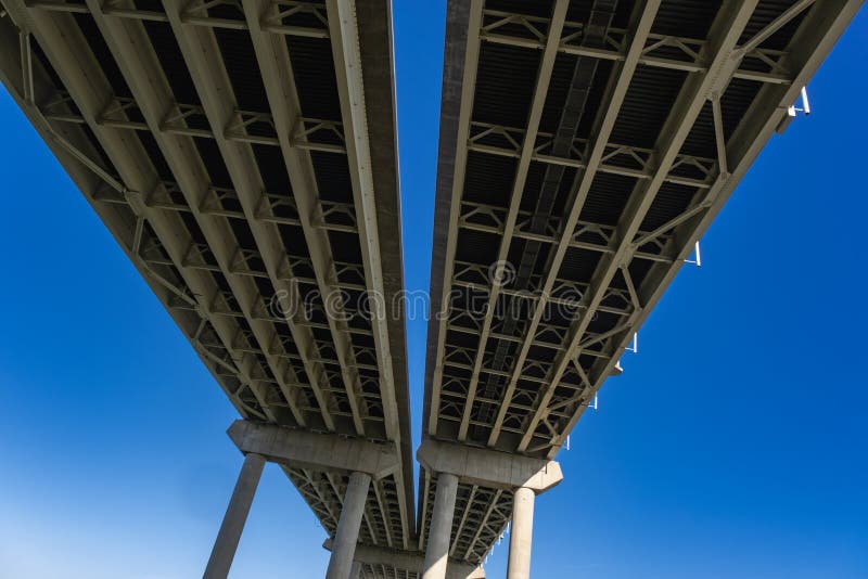 View Underneath a Large Bridge Highway on a Sunny Day with Blue Sky ...