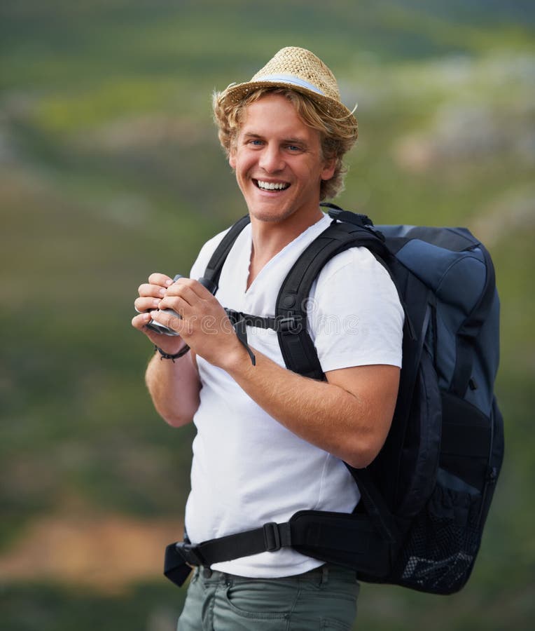 The View from Up Here is Sublime. Shot of a Young Man with Binoculars ...