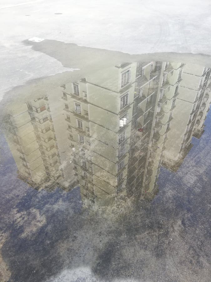 View of Upside Down Building Image in Water Puddle Stock Photo - Image ...
