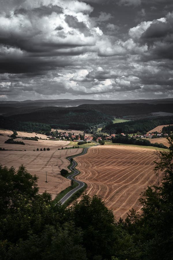 View of Valley with Fields and Village and Cloudy Sky Stock Image ...