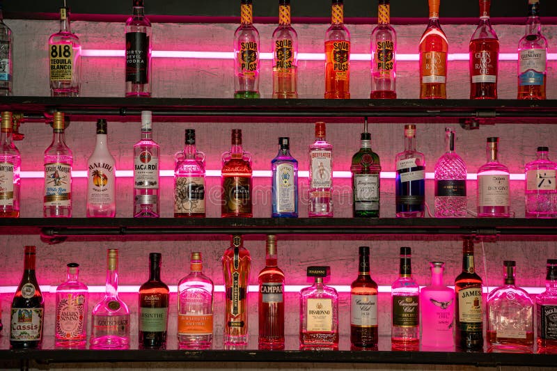 View of Various Liquor Bottles on a Bar Shelf. Editorial Stock Image ...