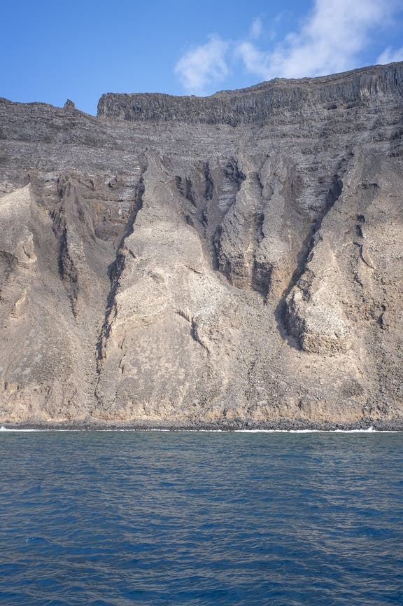 View of a Volcanic Cliff Seen from the Sea, with Forms of Lava Falling ...