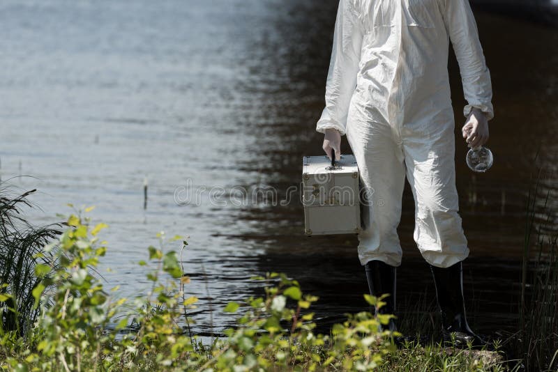 View of Water Inspector in Protective Costume Holding Inspection Kit ...