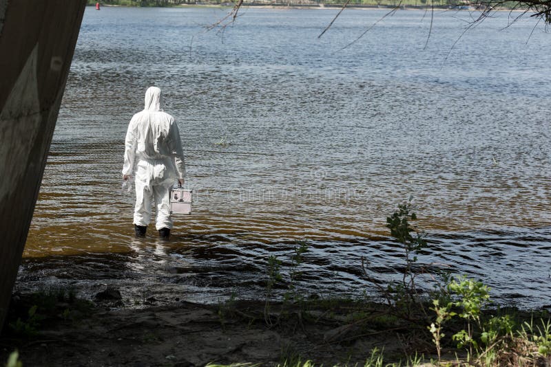 View of Water Inspector in Protective Costume Holding Inspection Kit in ...